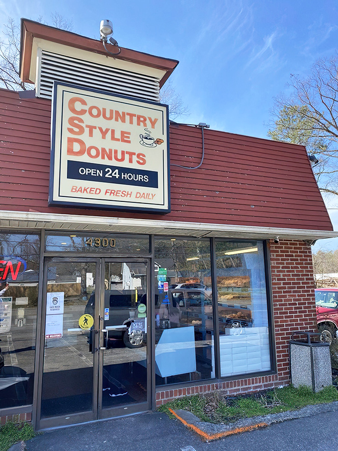 The red siding and vintage sign promise a time-traveling donut experience. Some buildings just whisper "delicious things happen here," and this one shouts it.