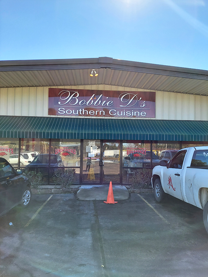 The unassuming exterior of Bobbie D's Southern Cuisine might not scream "culinary destination," but that green awning signals delicious treasures await inside.