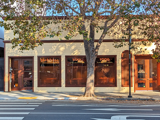 The unassuming cream exterior of Burdell belies the culinary magic happening inside. Like finding a secret doorway to flavor paradise in Oakland.