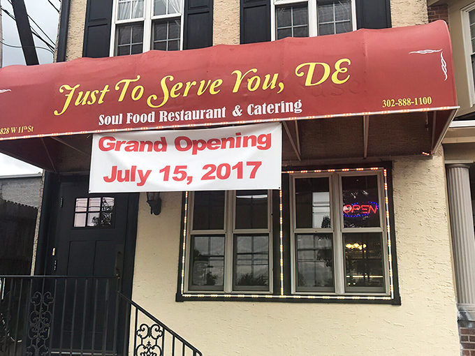 The unassuming storefront with its bright red awning promises culinary treasures within. Like finding a rare vinyl record, the joy is in the discovery.