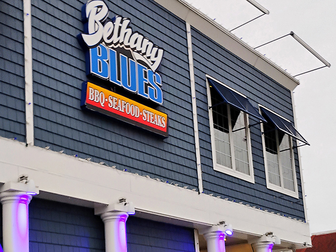 The coastal charm of Bethany Blues' exterior promises what lies within&mdash;a temple of smoke where beach vibes meet barbecue brilliance.