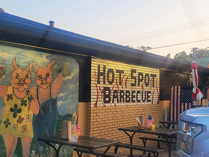 The unassuming exterior of Hot Spot Barbecue proves once again that the best barbecue joints often hide behind modest facades. Those yellow umbrellas practically whisper, "Smoke signals ahead!"