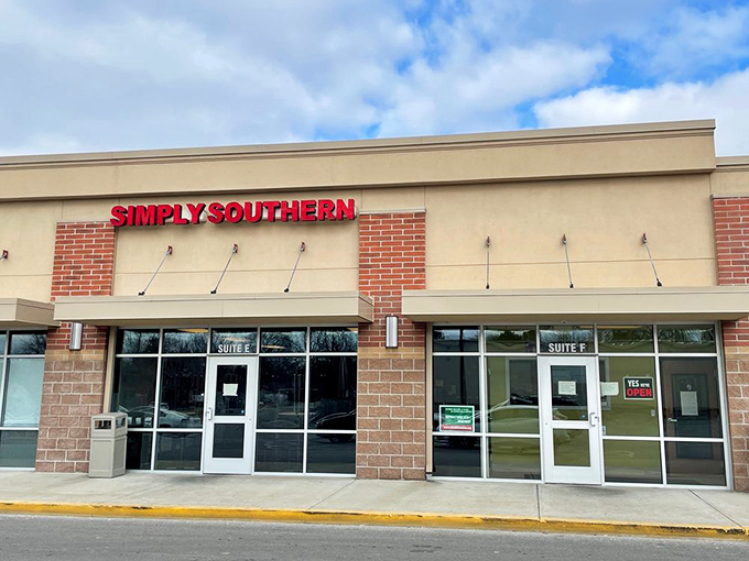The bright red signage beckons like a lighthouse for hungry souls. Simply Southern's modest exterior hides culinary treasures waiting to be discovered.