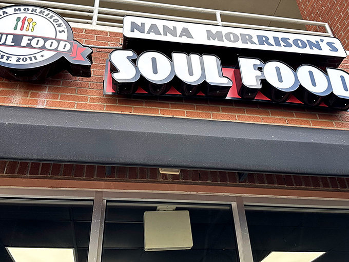 The welcoming storefront of Nana Morrison's Soul Food beckons hungry travelers with its classic brick facade and bold signage. Soul food salvation awaits inside.