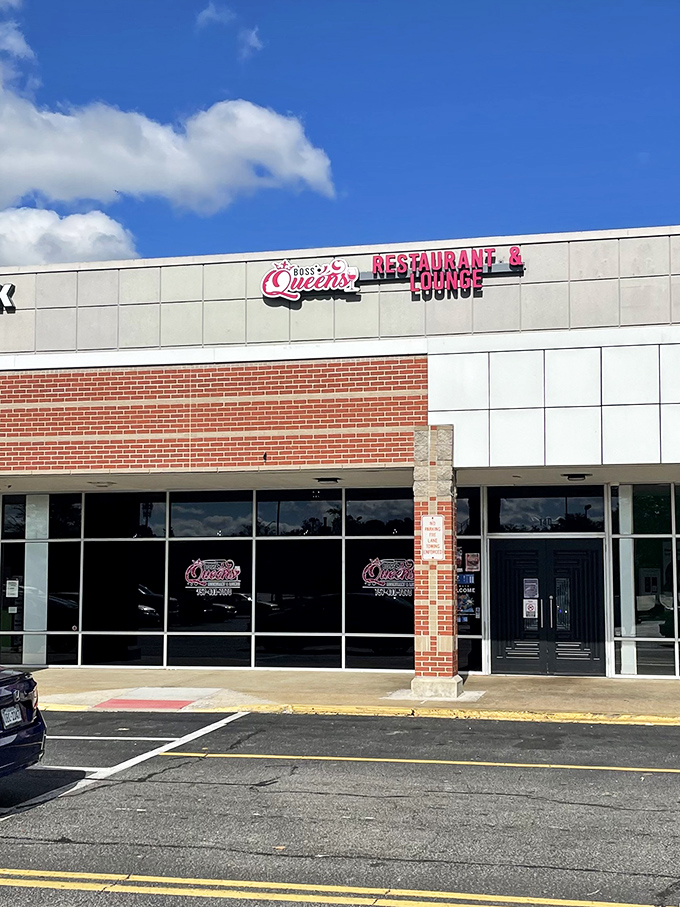 The modern brick-and-glass exterior of Boss Queens might look unassuming, but inside awaits a soul food revelation worth crossing state lines for.