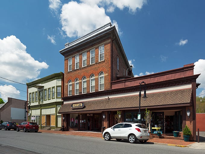 Historic brick buildings with bright red awnings line Oakland's main street &ndash; small-town charm that's aged like a fine wine.