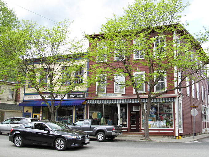 Historic brick buildings stand sentinel at Shelburne Falls' crossroads, where small-town charm meets architectural character that Norman Rockwell would have sketched with glee.