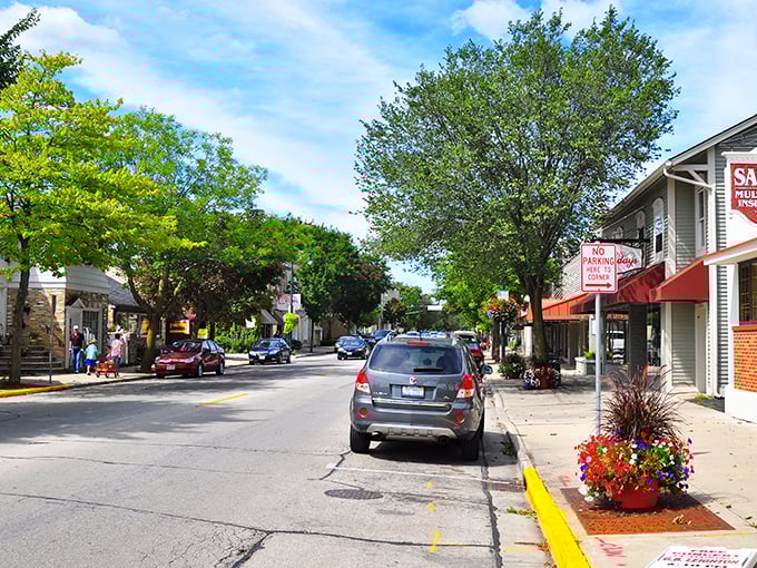 The limestone church stands like a medieval castle in autumn's golden embrace, a testament to Cedarburg's architectural heritage that stops first-time visitors in their tracks.