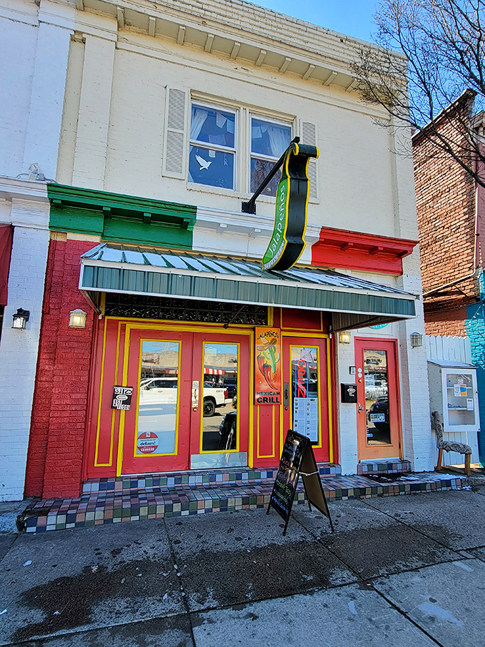 The modest red storefront screams "culinary destination," waving you in for a fiesta of flavors.