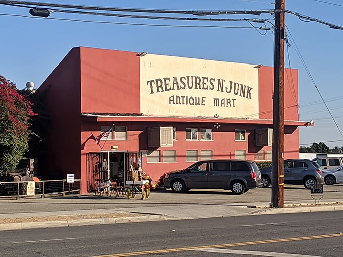 The terracotta fortress of forgotten treasures stands proudly on an Ontario street corner, its weathered sign promising both the sublime and the ridiculous.