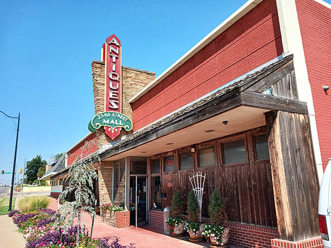 The iconic vintage sign beckons like a time-travel invitation, promising treasures inside this brick building on Oklahoma City's 23rd Street.