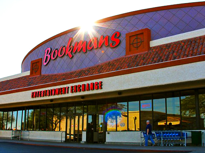 The iconic blue-tiled facade with its bold red Bookmans sign promises adventure before you even step inside. Arizona sunshine makes everything look like possibility.