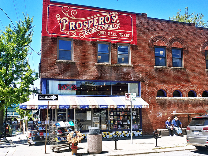 The iconic red and gold sign of Prospero's Books beckons bibliophiles like a literary lighthouse on 39th Street. Books, media, and endless possibilities await.
