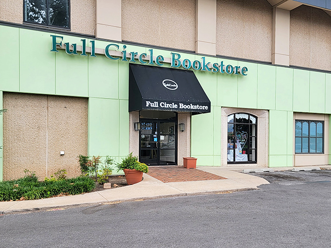 The distinctive green facade of Full Circle Bookstore welcomes bibliophiles with a chalk-written "Welcome" that feels like a literary hug.