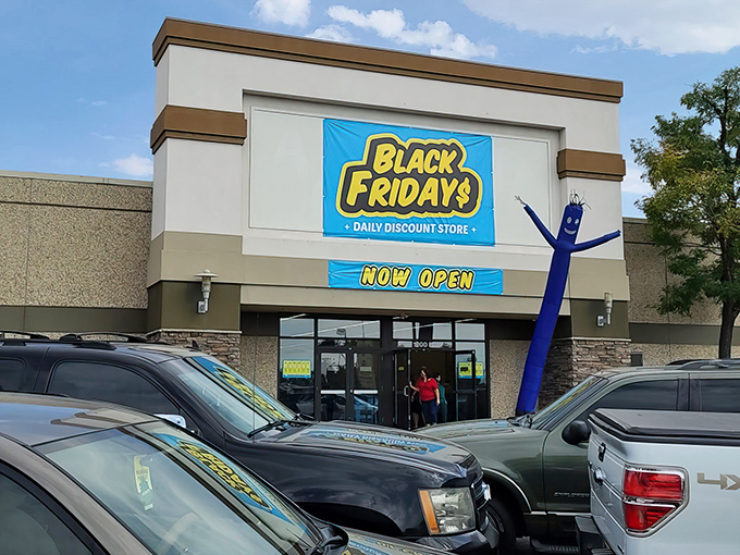 The bright yellow sign of Black Fridays beckons like a retail lighthouse, promising treasure hunters daily discounts in Aurora's shopping seascape.