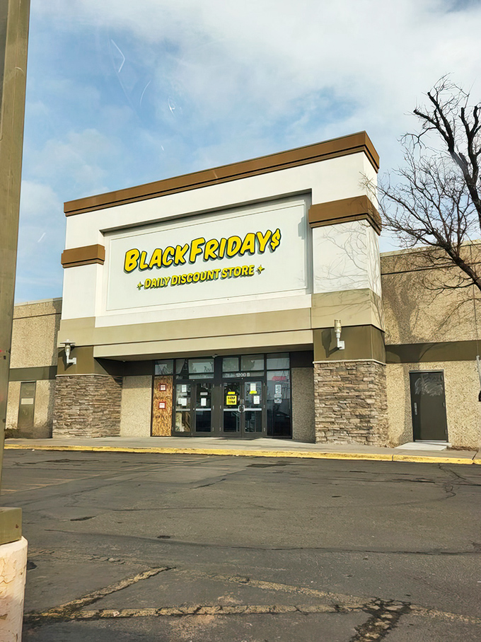 The bright yellow sign of Black Fridays beckons like a retail lighthouse, promising treasure hunters daily discounts in Aurora's shopping seascape.