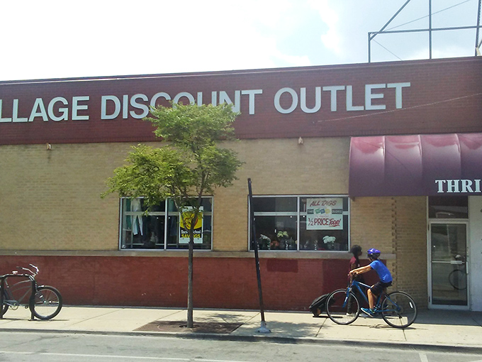 The unassuming brick facade of Village Discount Outlet on Clark Street - Chicago's Narnia wardrobe for bargain hunters seeking retail adventure.