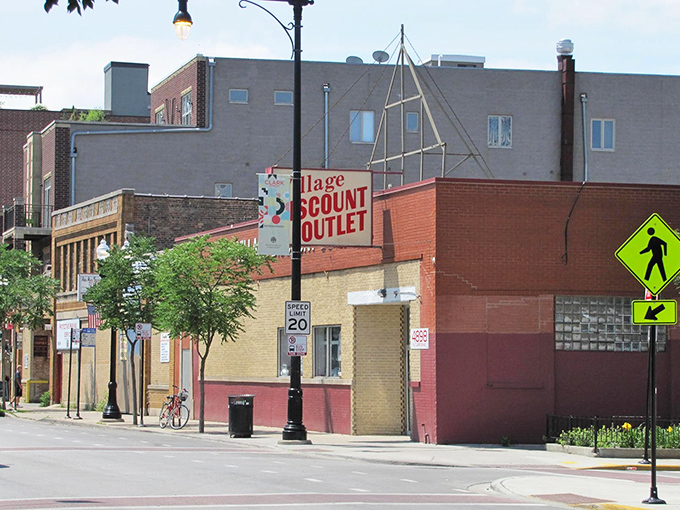 The unassuming brick facade of Village Discount Outlet on Clark Street - Chicago's Narnia wardrobe for bargain hunters seeking retail adventure.