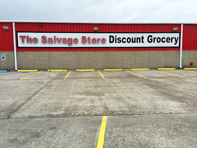 The bright red exterior of The Salvage Store stands out like a beacon for bargain hunters, promising treasure inside those unassuming walls.