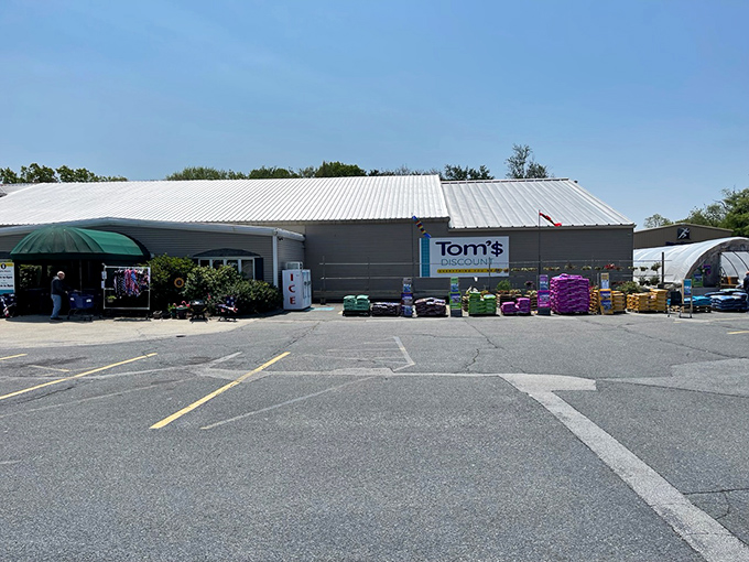 The unassuming exterior of Tom's Discount Store &ndash; where retail magic happens without the fancy wrapping. Bargain paradise awaits!