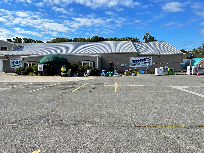 The unassuming exterior of Tom's Discount Store &ndash; where retail magic happens without the fancy wrapping. Bargain paradise awaits!