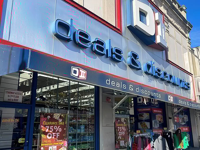 The blue and red signage of DII Deals & Discounts beckons like a siren song to bargain hunters navigating the urban landscape of Jersey City.
