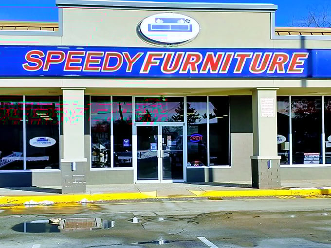 The blue and red storefront beckons like a furniture oasis in the strip mall desert. No pretension, just promises of comfortable living ahead.