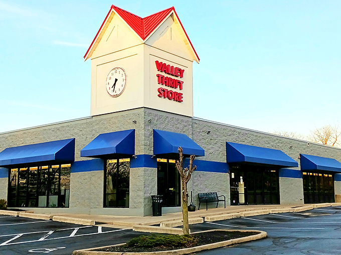 The blue-trimmed exterior of Valley Thrift Store stands like a beacon of bargain possibilities, promising treasure hunts that begin the moment you park your car.