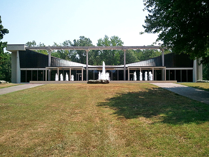 The Museum of Automobiles stands like a mid-century modern temple to transportation, its distinctive butterfly roof and dancing fountains welcoming visitors to automotive paradise.