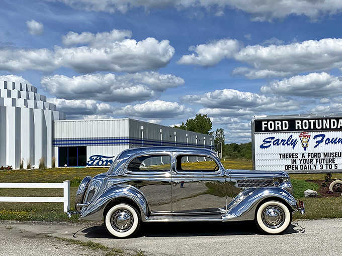 A gleaming 1936 Ford sedan poses like a silver screen starlet against the museum's distinctive white architecture. Automotive time travel at its finest.