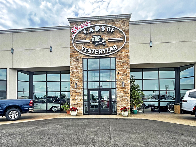The stone-accented entrance to Swope's Cars of Yesteryear Museum stands like a portal to automotive history, promising chrome-plated treasures within.