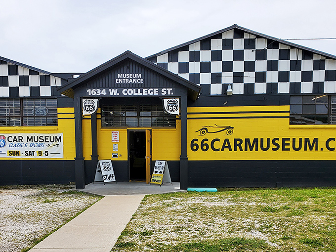 The checkered-flag exterior of Route 66 Car Museum practically screams "START YOUR ENGINES!" – a roadside beacon for automotive enthusiasts in Springfield.