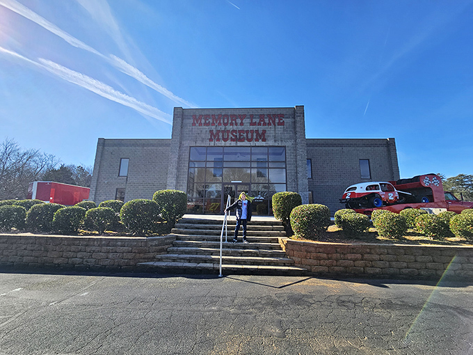 The unassuming exterior of Memory Lane Museum stands like a vault of automotive history, promising treasures that would make any car enthusiast's heart race faster than a NASCAR qualifier.