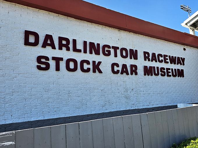 The unassuming white brick facade belies the treasures within, like finding a five-star restaurant in a gas station. Racing history awaits!