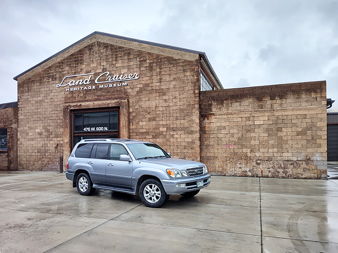 The unassuming brick exterior of the Land Cruiser Heritage Museum hides a treasure trove of automotive history, like finding a Rolex at a yard sale.