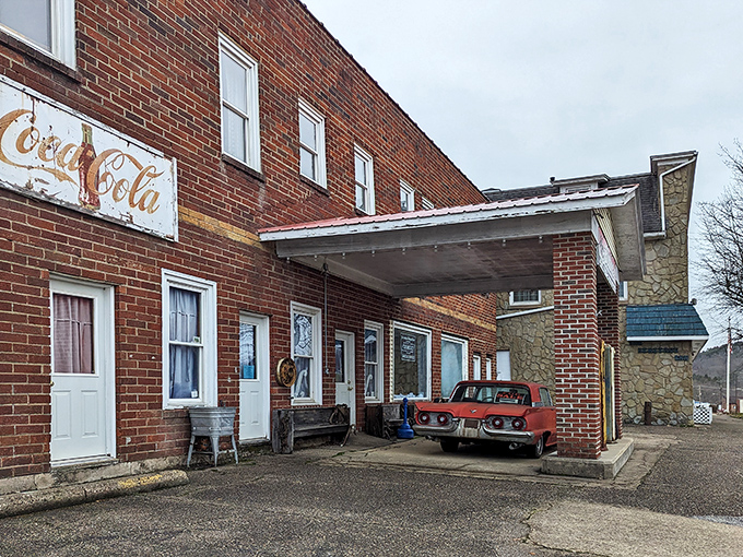 The brick facade of "The Building" with its vintage gas pumps standing guard feels like a time portal to America's automotive golden age.