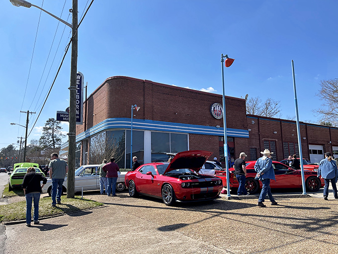 That vintage neon sign beckoning from the street promises automotive adventures that'll make your heart race faster than a Hemi.