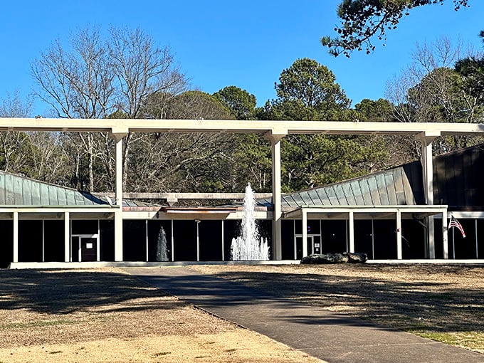 The Museum of Automobiles stands like a mid-century modern temple to transportation, its distinctive butterfly roof and dancing fountains welcoming visitors to automotive paradise.