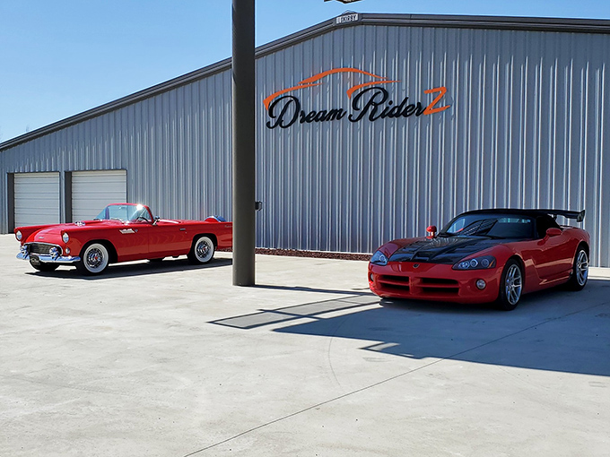 The classic American silhouette beneath the Dream Riderz sign&mdash;where nostalgia meets horsepower on the Mississippi horizon.