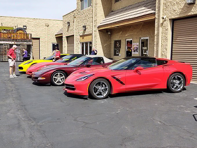 Modern muscle meets classic charm outside Nostalgia Street Rods. These gleaming Corvettes are just appetizers for the automotive feast waiting inside.