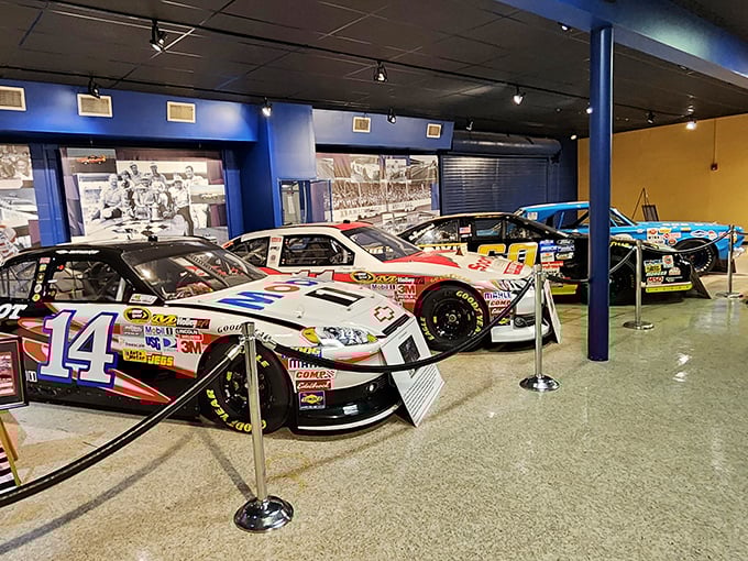 The unassuming white brick facade belies the treasures within, like finding a five-star restaurant in a gas station. Racing history awaits!