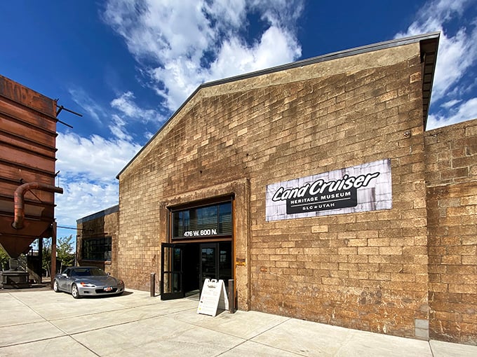 The unassuming brick exterior of the Land Cruiser Heritage Museum hides a treasure trove of automotive history, like finding a Rolex at a yard sale.