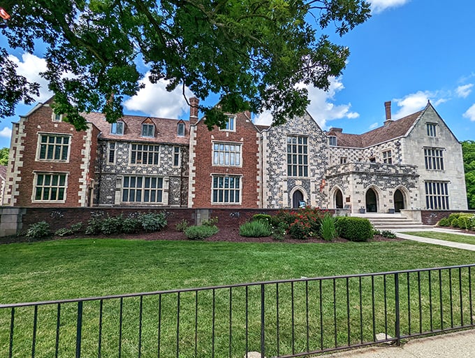 The fa&ccedil;ade of Salisbury House combines red brick and flint-speckled limestone in a Tudor masterpiece that makes Iowa feel decidedly more Downton Abbey than downtown Des Moines.