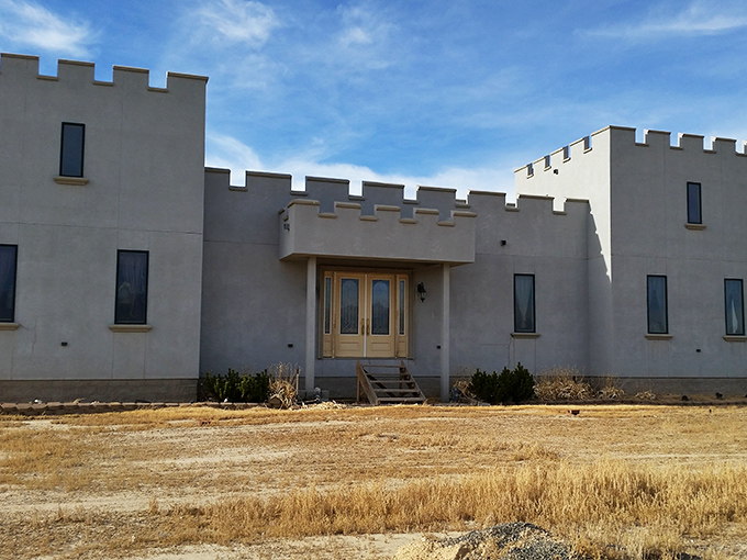 A medieval mirage rising from the Nevada desert, Paradise Ranch Castle stands defiantly against convention, its crenellated towers declaring "Yes, we built a castle in sagebrush country."