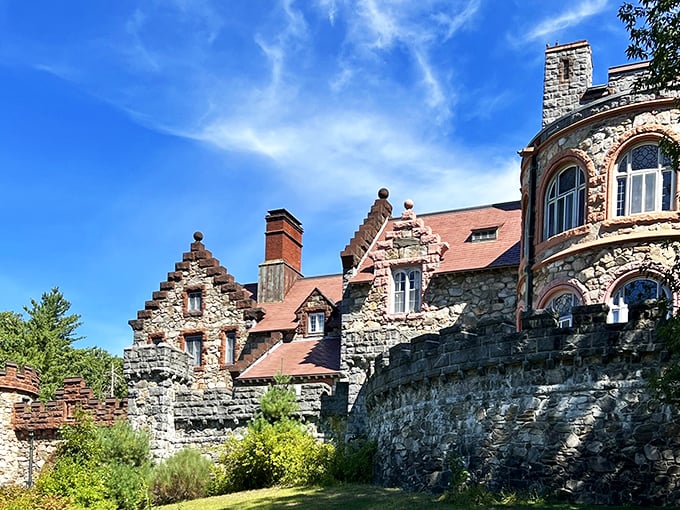 The grand entrance to Searles Castle looks like the perfect setting for a medieval fantasy film, complete with stone turrets and battlements nestled among New Hampshire pines.
