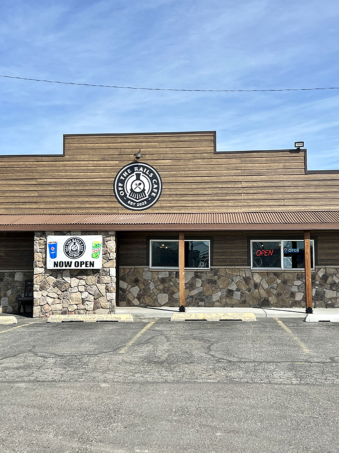 The unassuming exterior of Off The Rails Cafe stands like a culinary frontier outpost, promising hearty delights within those rustic wooden walls.