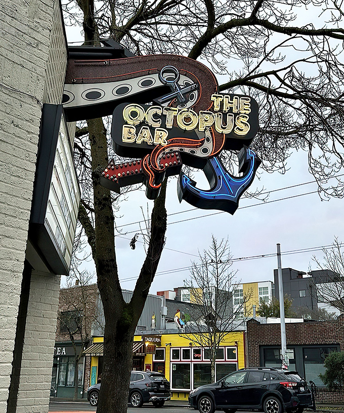 The white brick facade of The Octopus Bar might seem unassuming, but that blue cephalopod sign promises an evening of maritime mischief awaits inside.