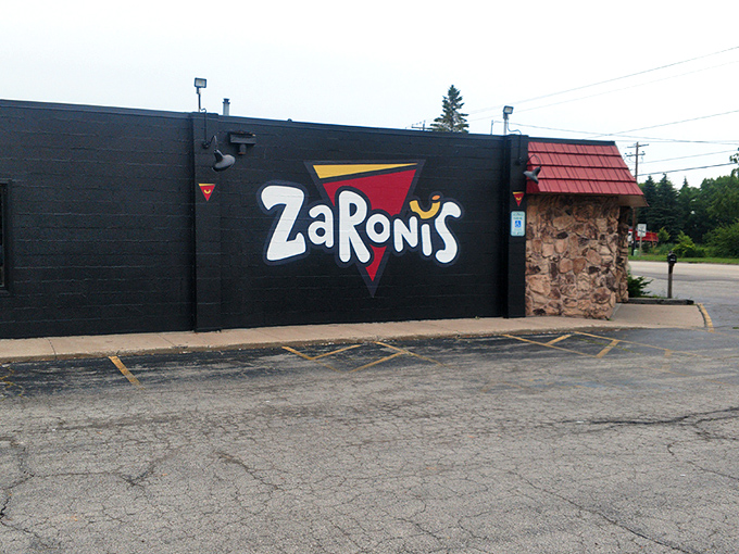 The bold, playful logo on ZaRoni's exterior wall is like a bat signal for the pizza-obsessed. Come for the quirky name, stay for the culinary adventure. 