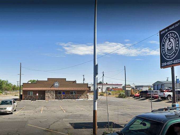 The unassuming exterior of Off The Rails Cafe stands like a frontier outpost of flavor, promising culinary adventures behind that rustic stone facade.
