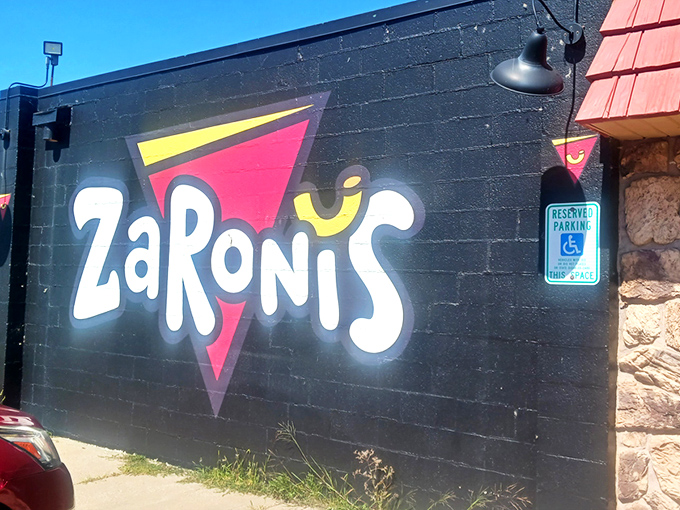 The bold, playful logo on ZaRoni's exterior wall is like a bat signal for the pizza-obsessed. Come for the quirky name, stay for the culinary adventure. 